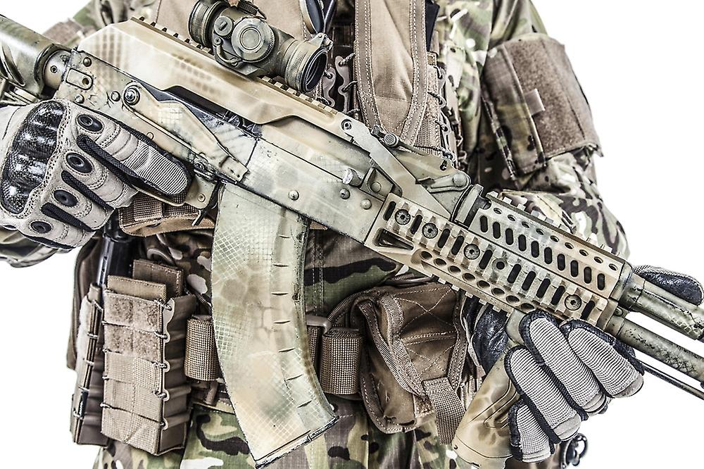 Close-up shot of Kalashnikov rifle in hands of Army special forces ...
