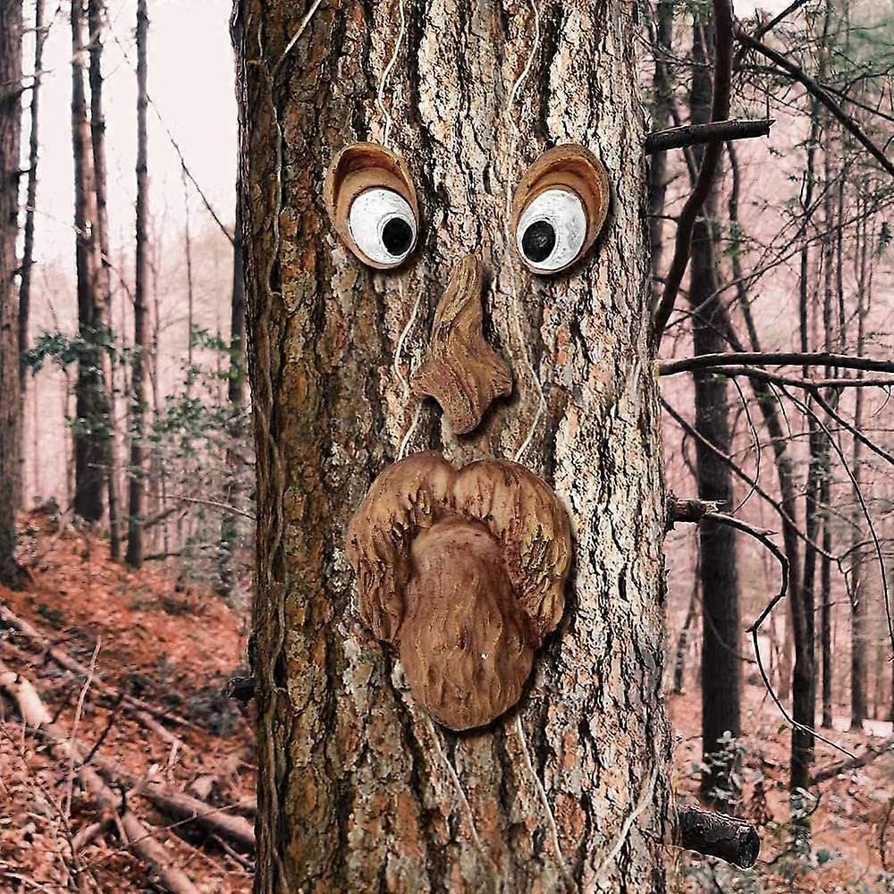 Tree face outdoor statue old man tree hugging bark grimace facial ...