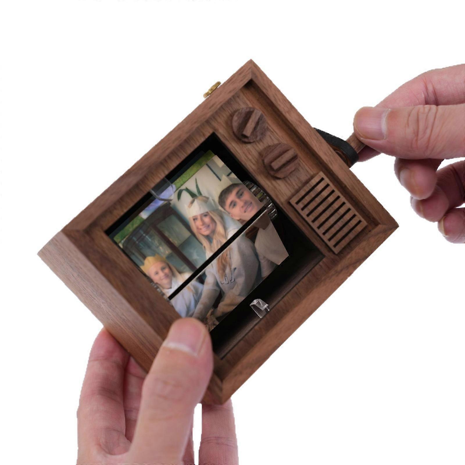 Illuminated, hand-cranked flipss-page photo machine with 16-photo album ...