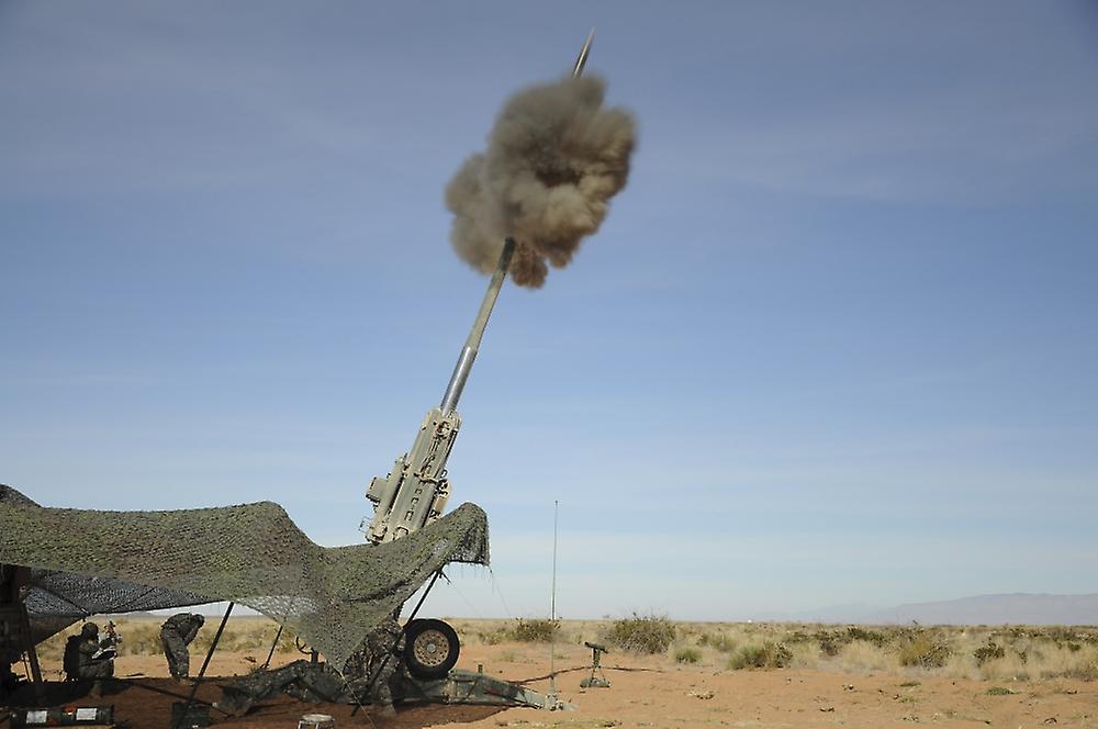 The M982 Excalibur 155mm round leaves the barrel of an M777 Howitzer ...