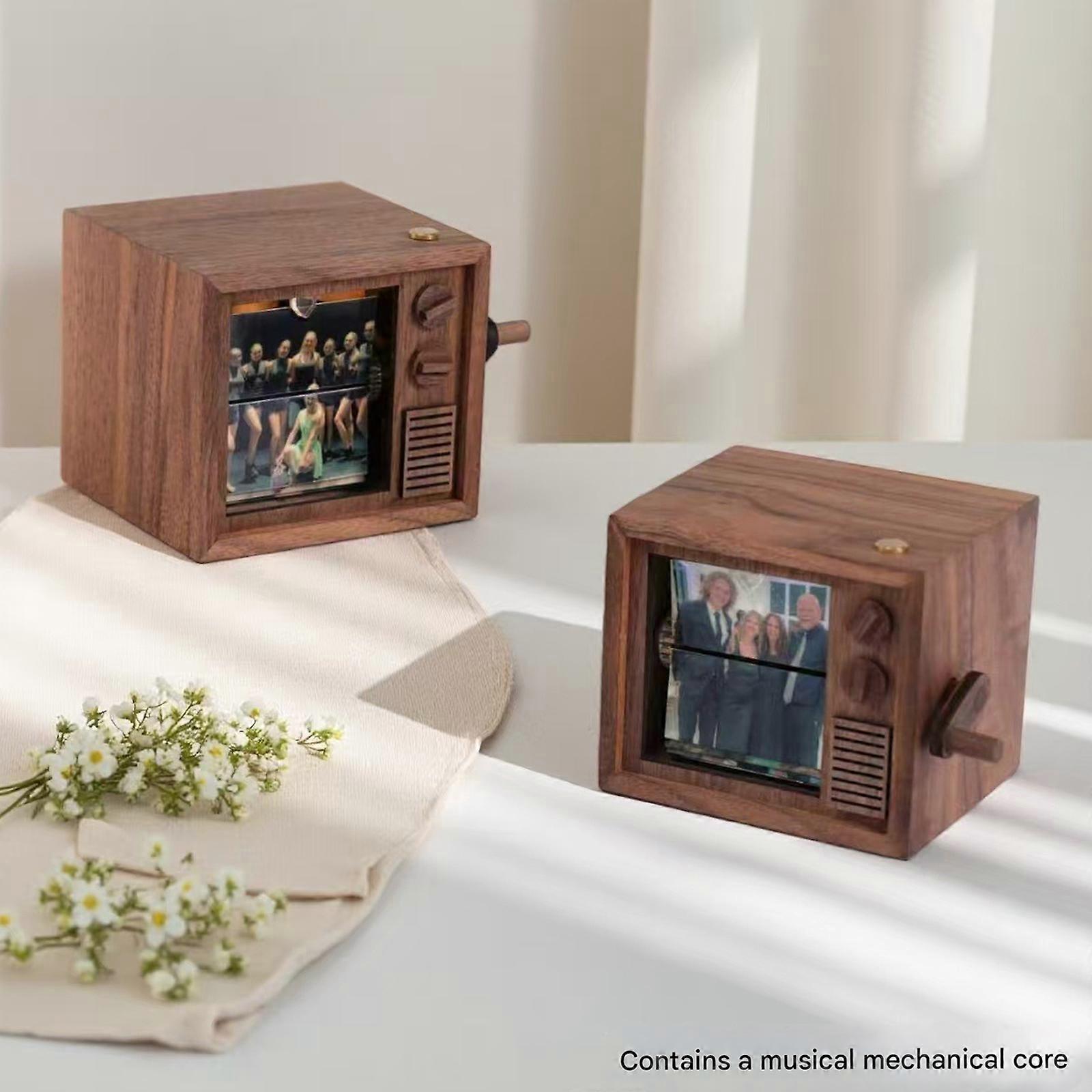 Illuminated, hand-cranked flipss-page photo machine with 16-photo album ...